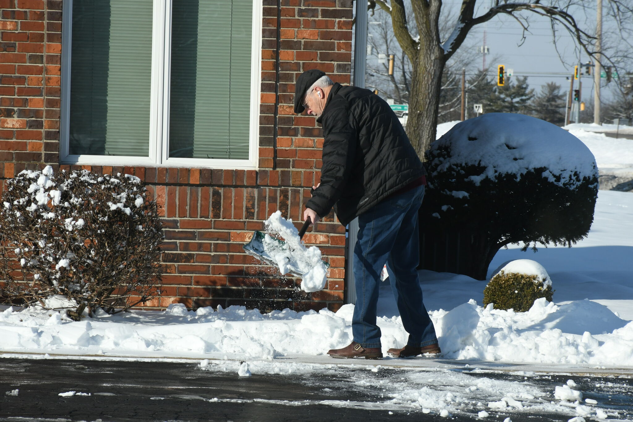 Alton residents tackle heavy snowfall; some dream of warmer climates