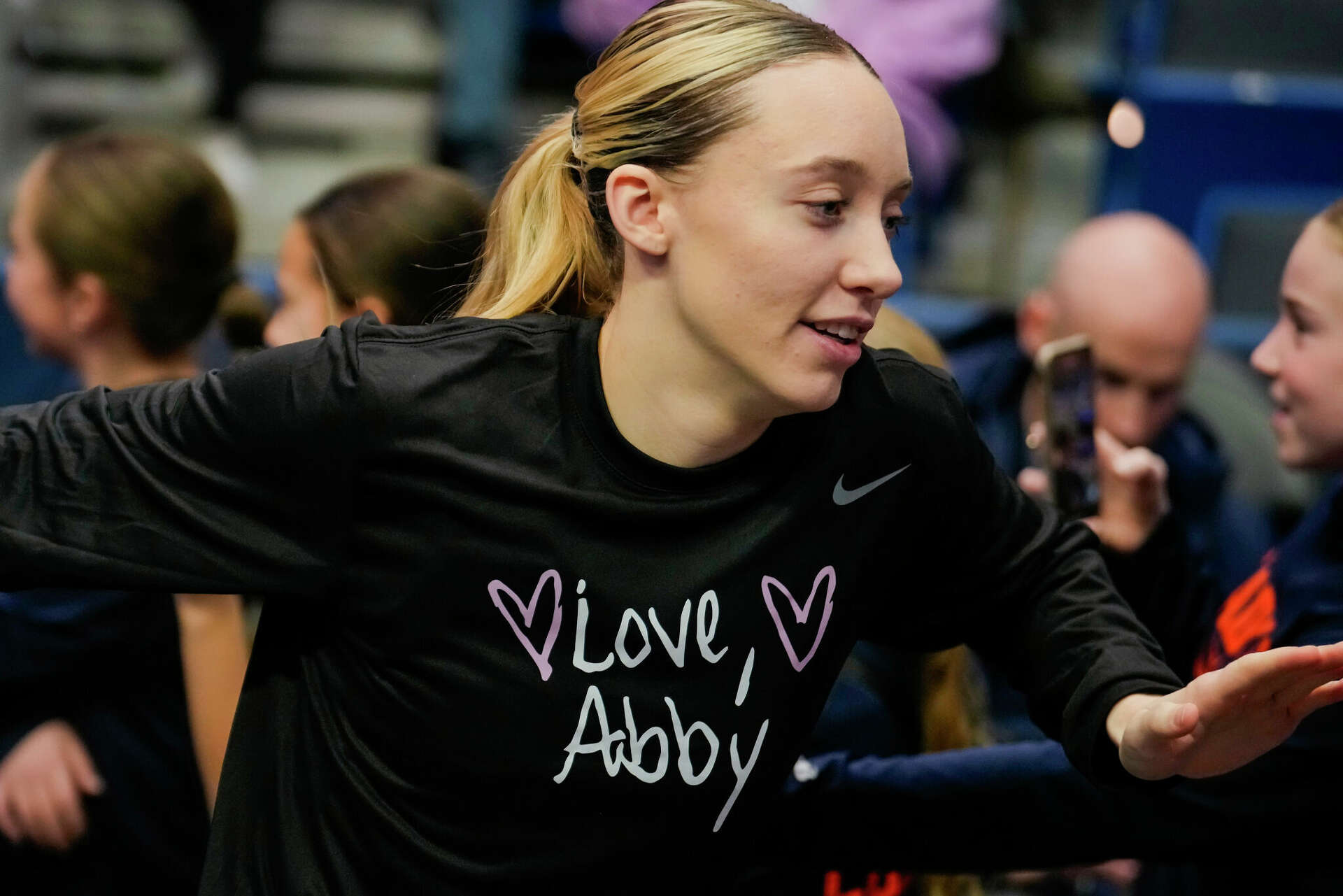 UConn women's basketball team wearing shirts to honor late fan