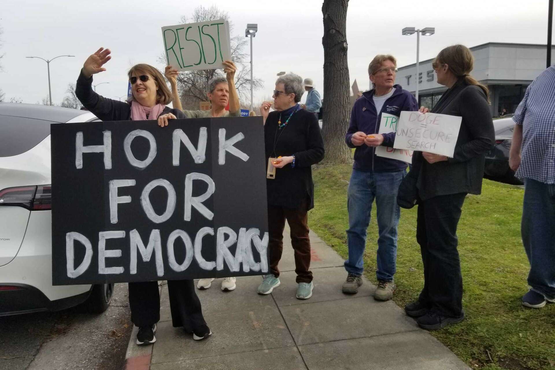 Bay Area protests outside Tesla showrooms seek to dissuade buyers