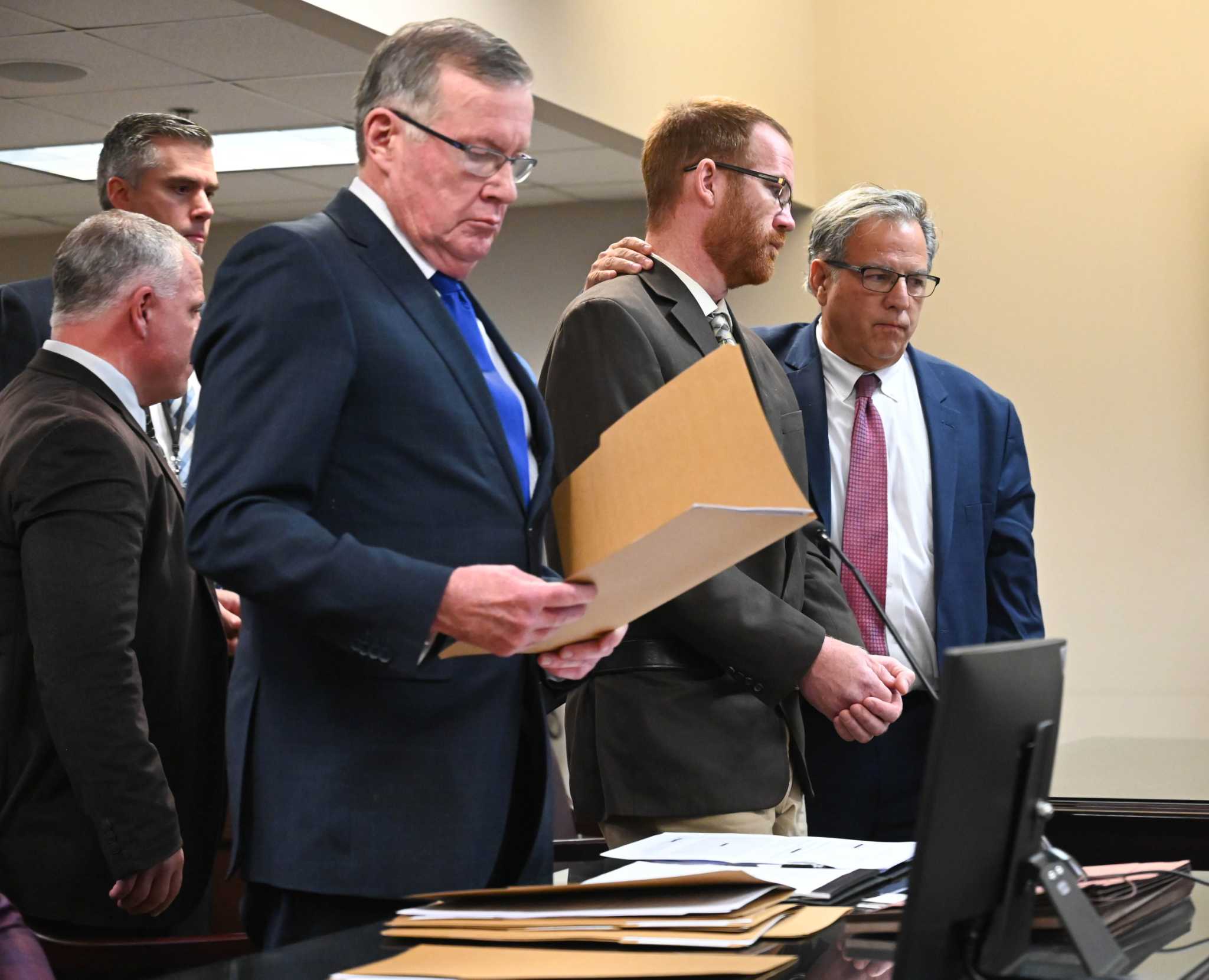 Prison murder case opens with prosecutor calling officers 'a gang'