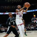 After being at death's door, Houston basketball legend Dwight Jones ...