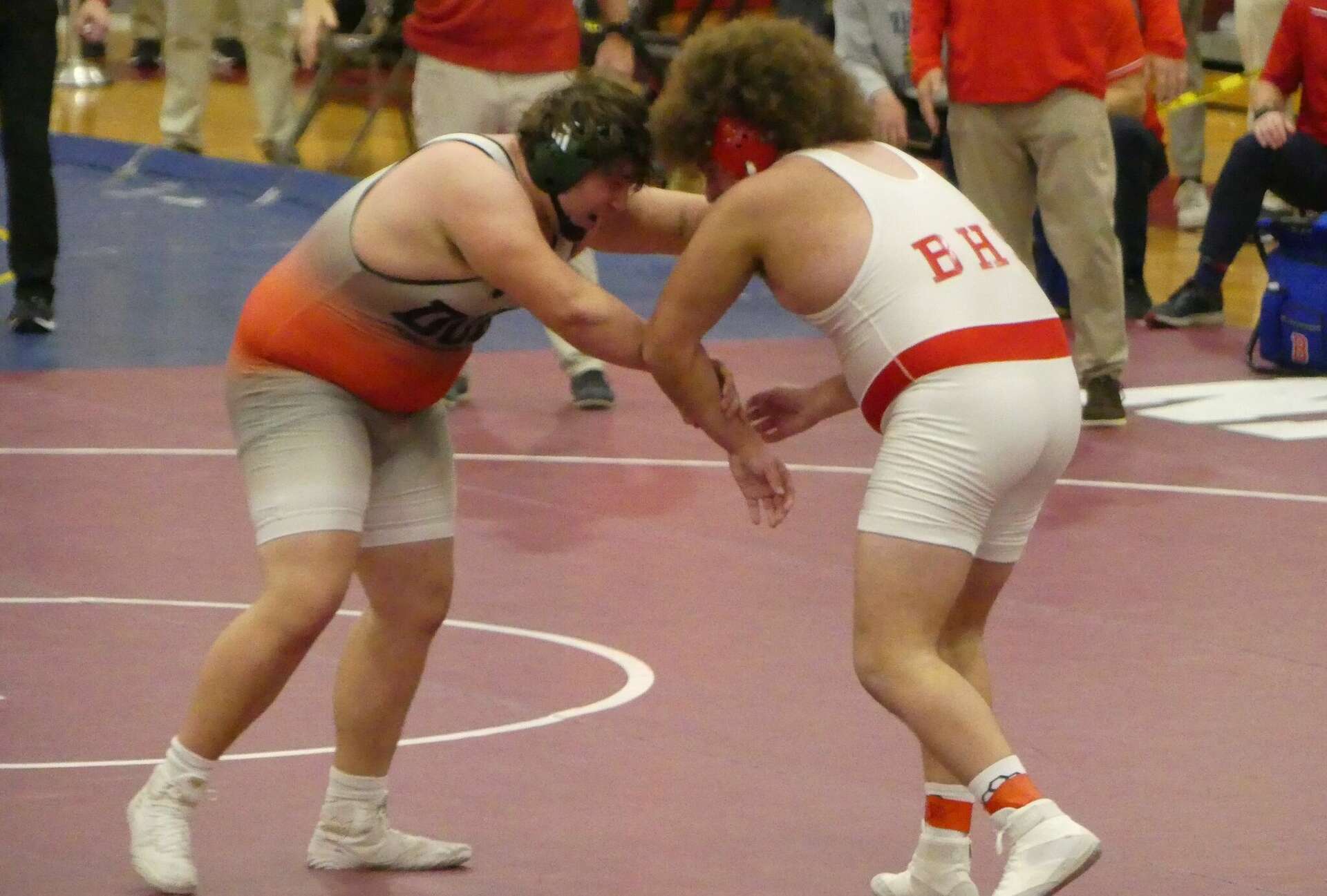 CT high school wrestler wears State Open crown on trademark hair