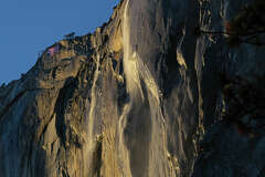Photos: ‘Distress flag’ protests Yosemite cuts as crowds view firefall