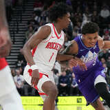 After being at death's door, Houston basketball legend Dwight Jones ...