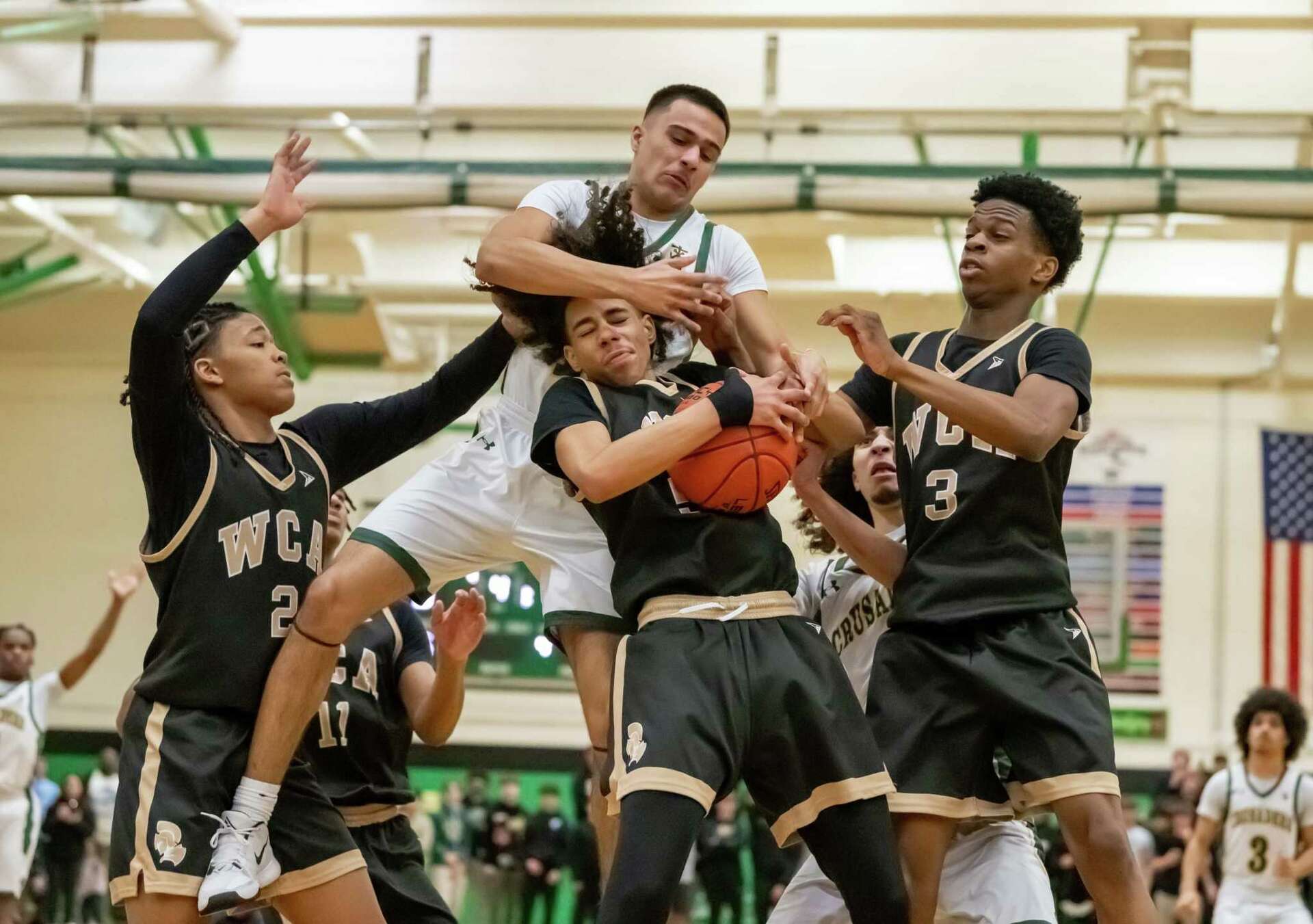 WCA boys basketball takes down Holy Cross for third straight NVL title