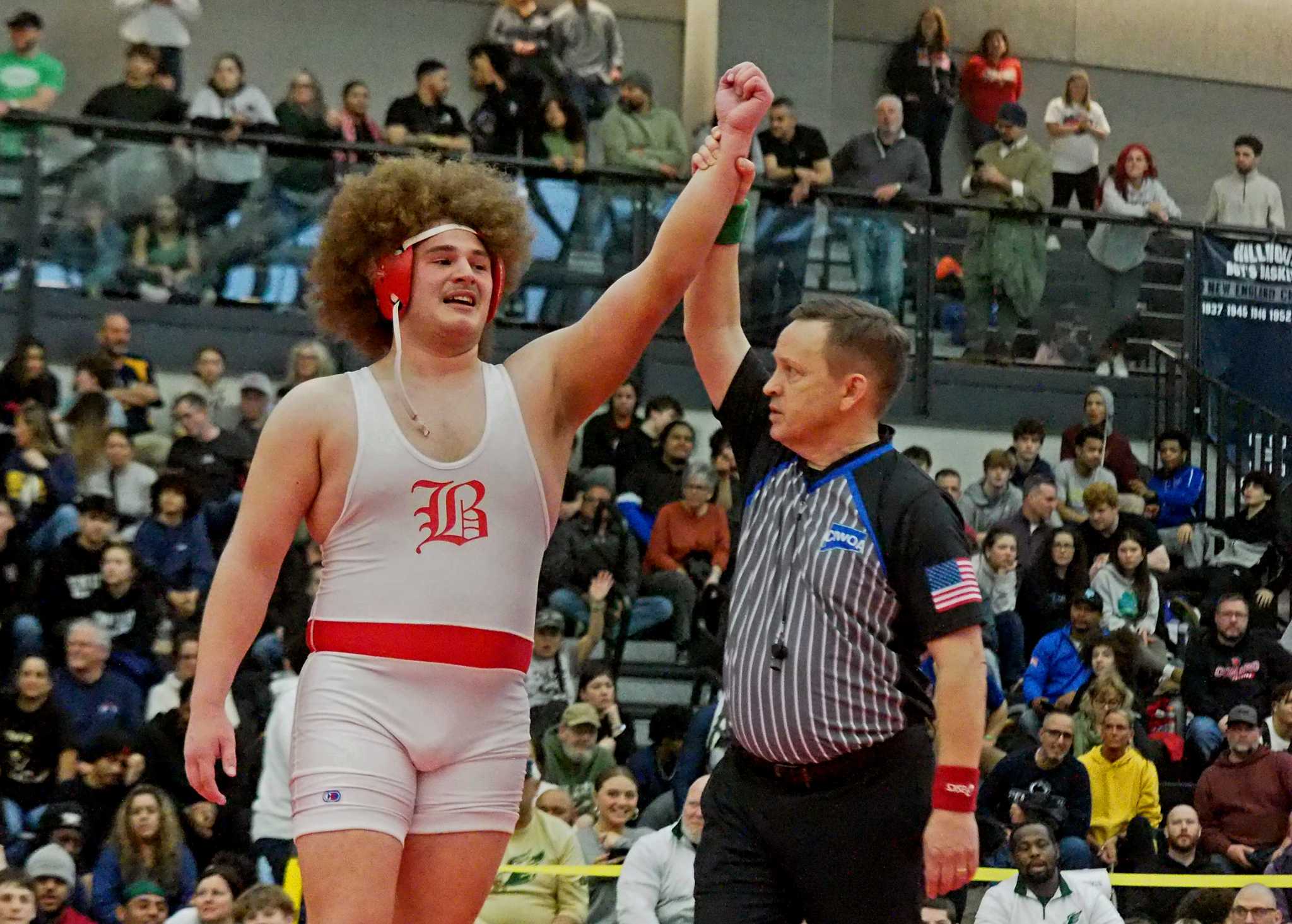 CT high school wrestler wears State Open crown on trademark hair