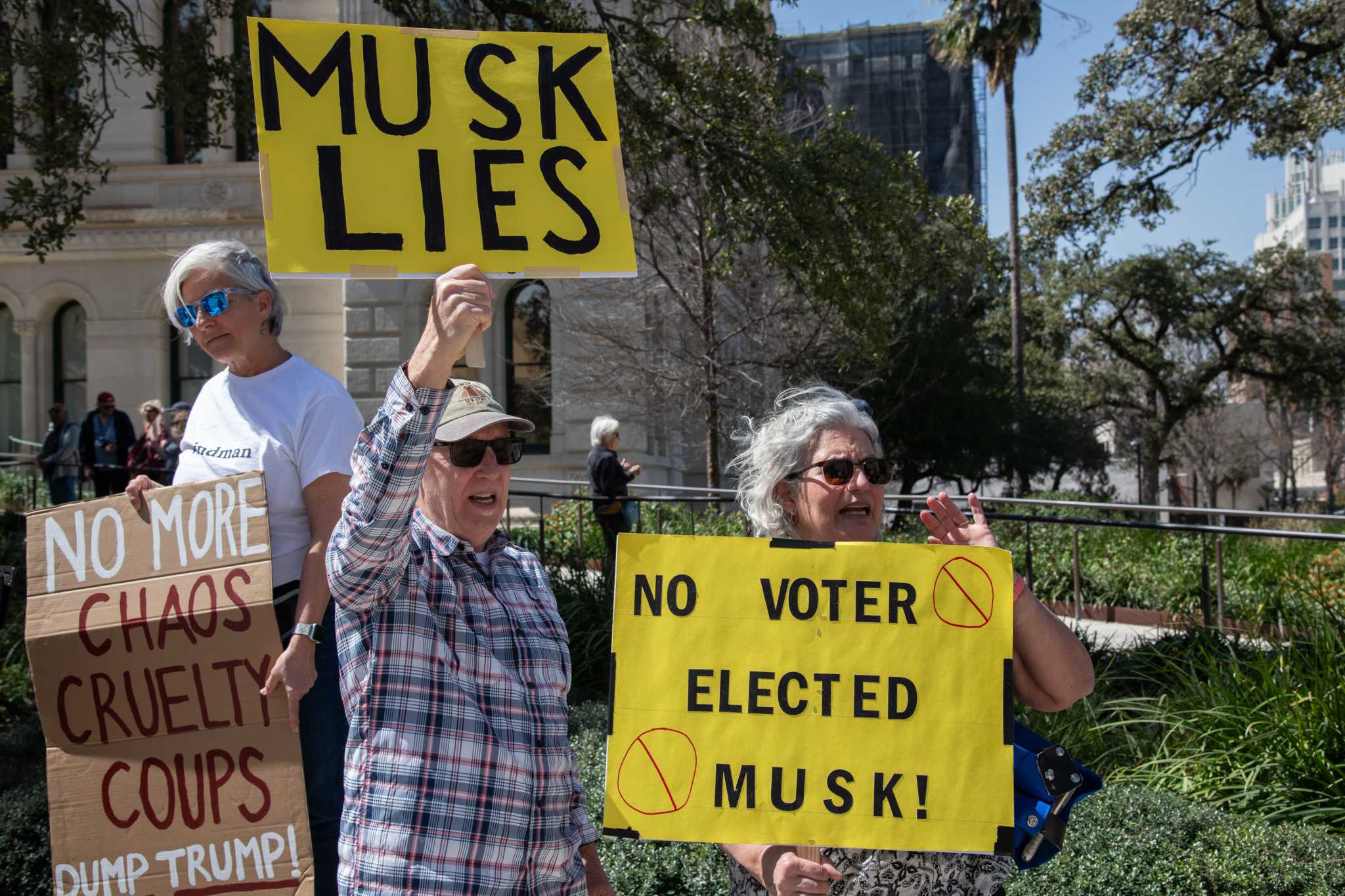 Activists protest DOGE, Musk 'fascist takeover' at Tesla showrooms