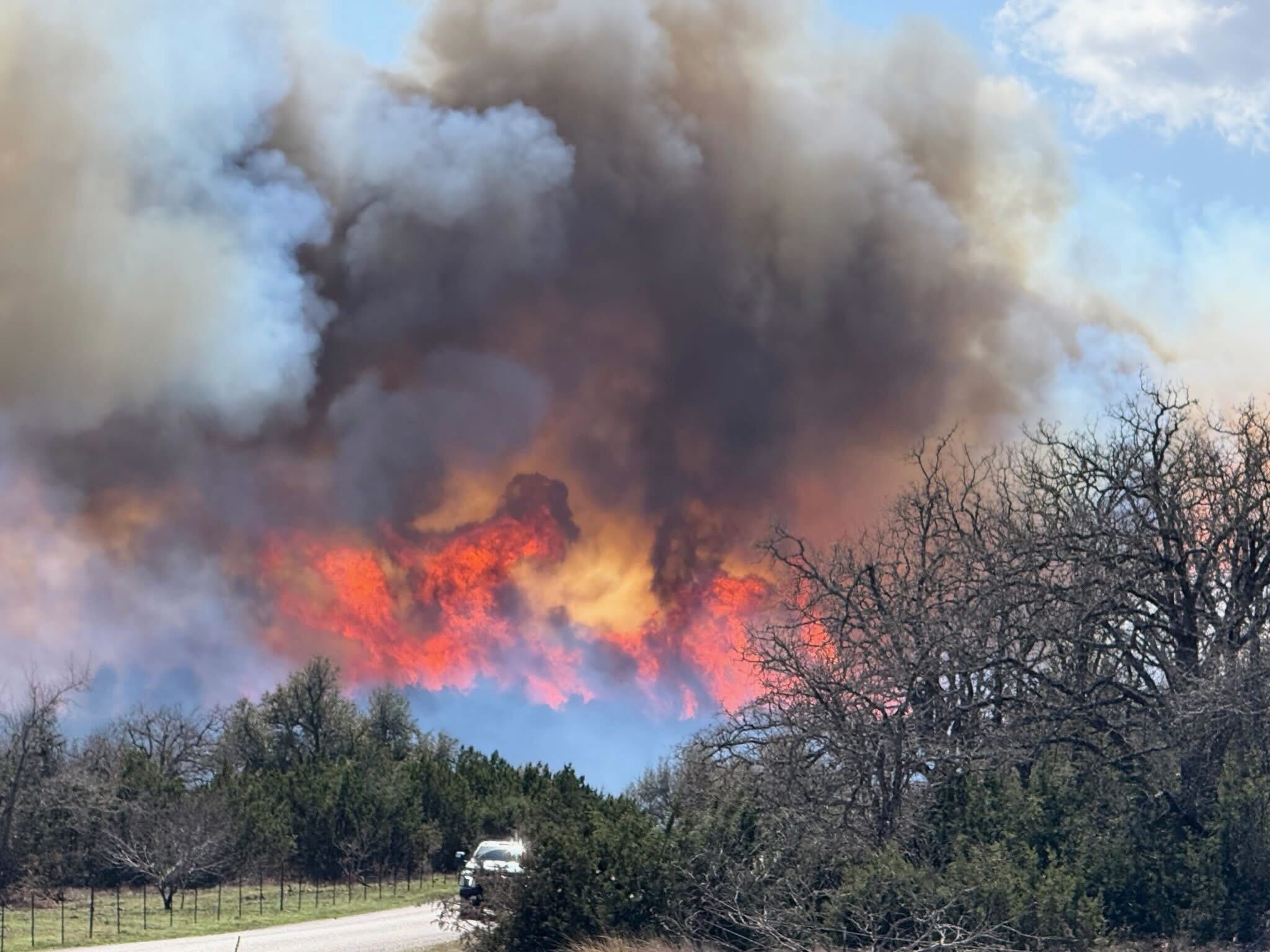 Fire crews battle 8,640-acre fire near Fredericksburg