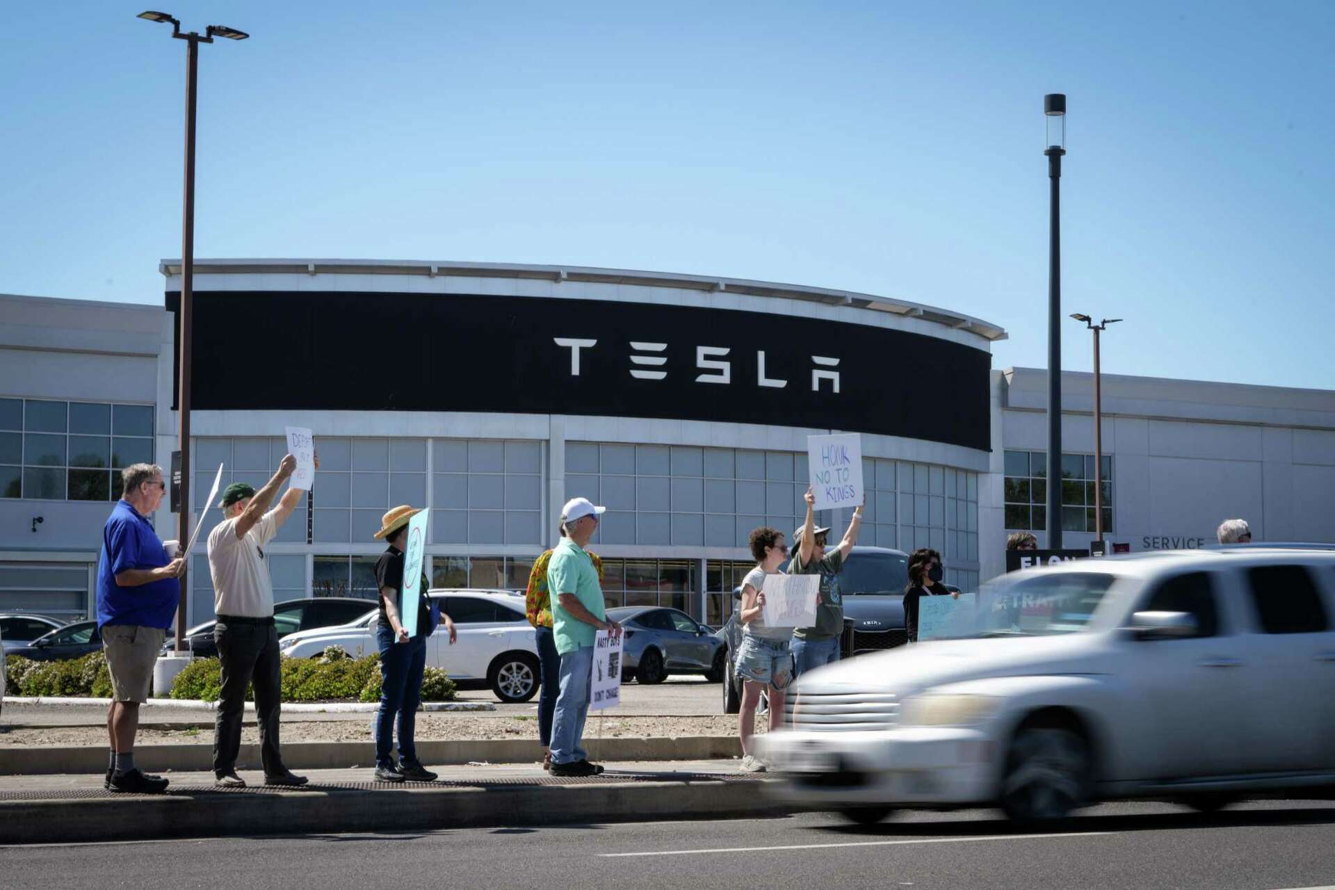 Houston Tesla protest draws dozens to display disapproval of Musk
