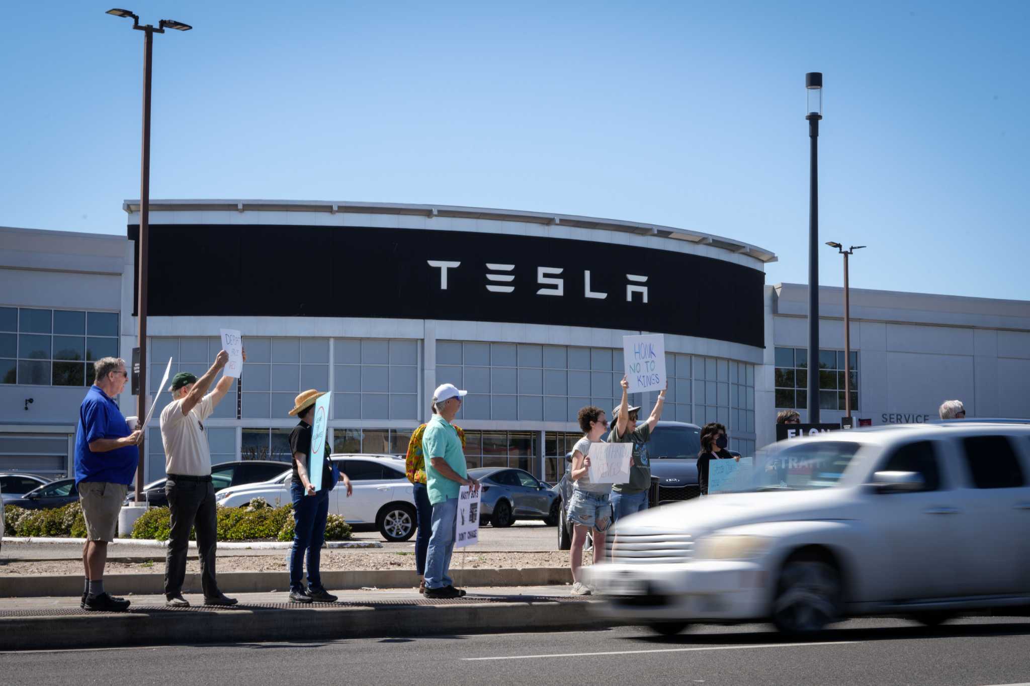 Houston Tesla protest draws dozens to display disapproval of Musk