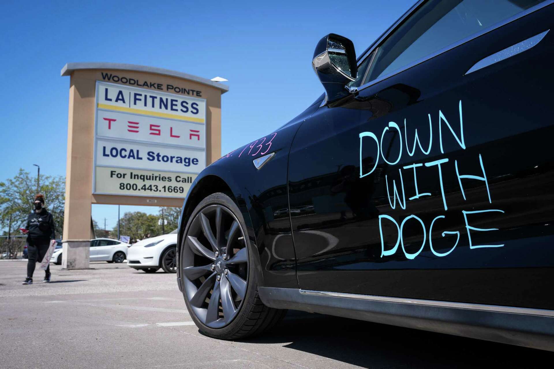 Houston Tesla protest draws dozens to display disapproval of Musk