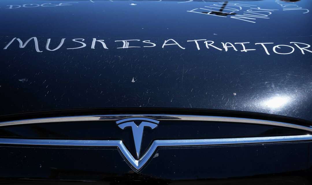 Houston Tesla protest draws dozens to display disapproval of Musk
