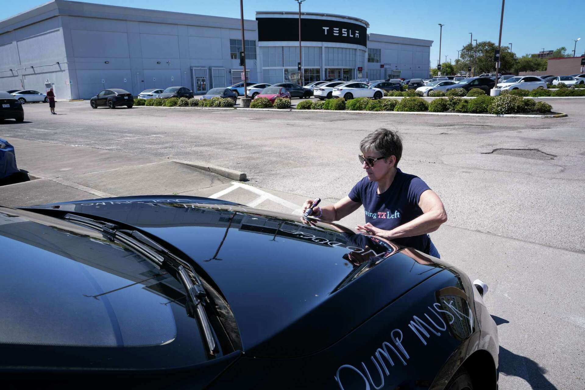Houston Tesla protest draws dozens to display disapproval of Musk