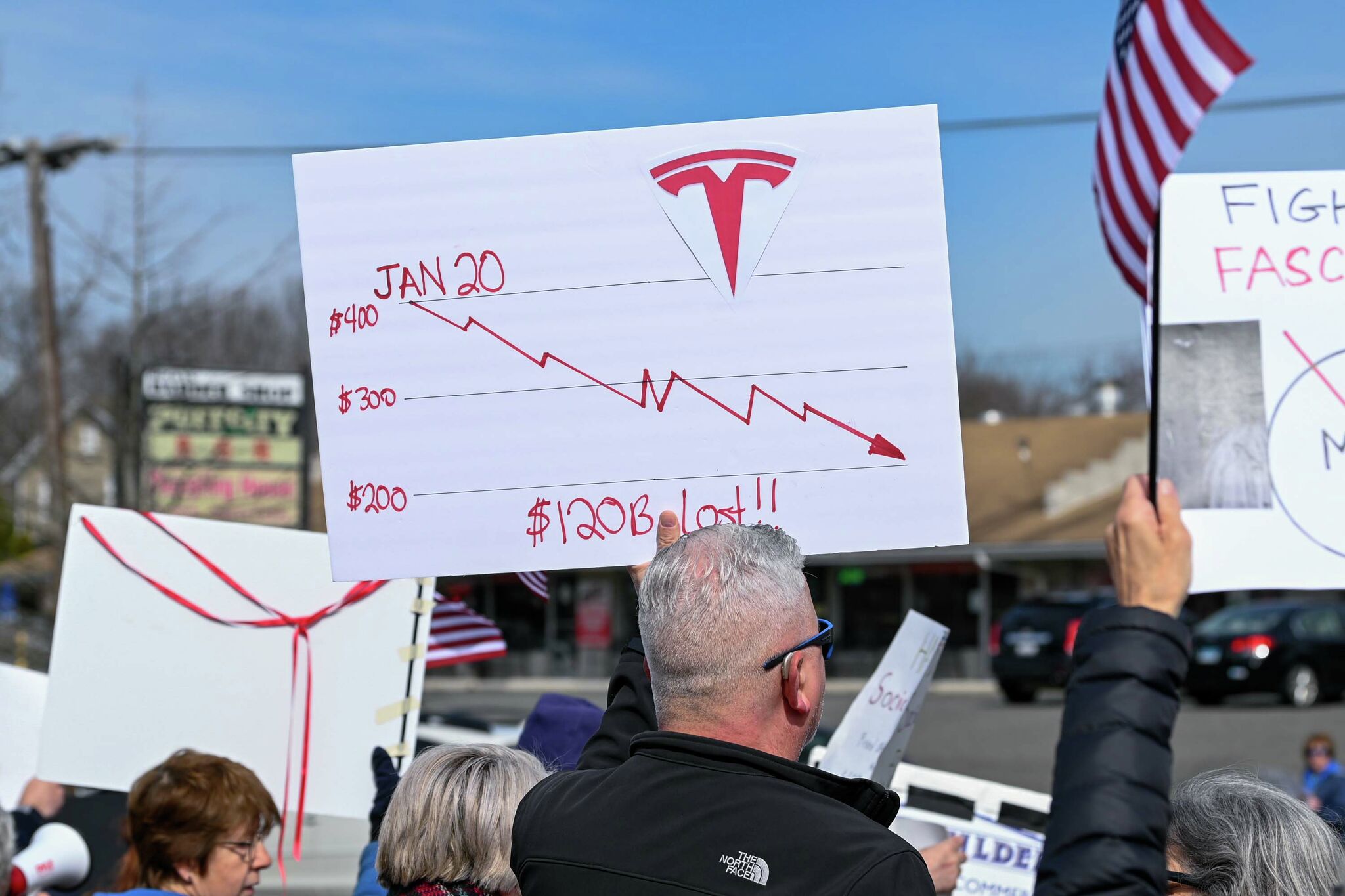 Hundreds protest outside Milford Tesla showroom Saturday