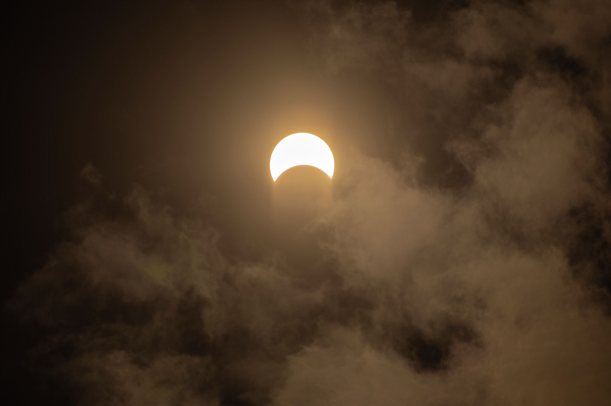 What time is the partial solar eclipse in the northeast this weekend?