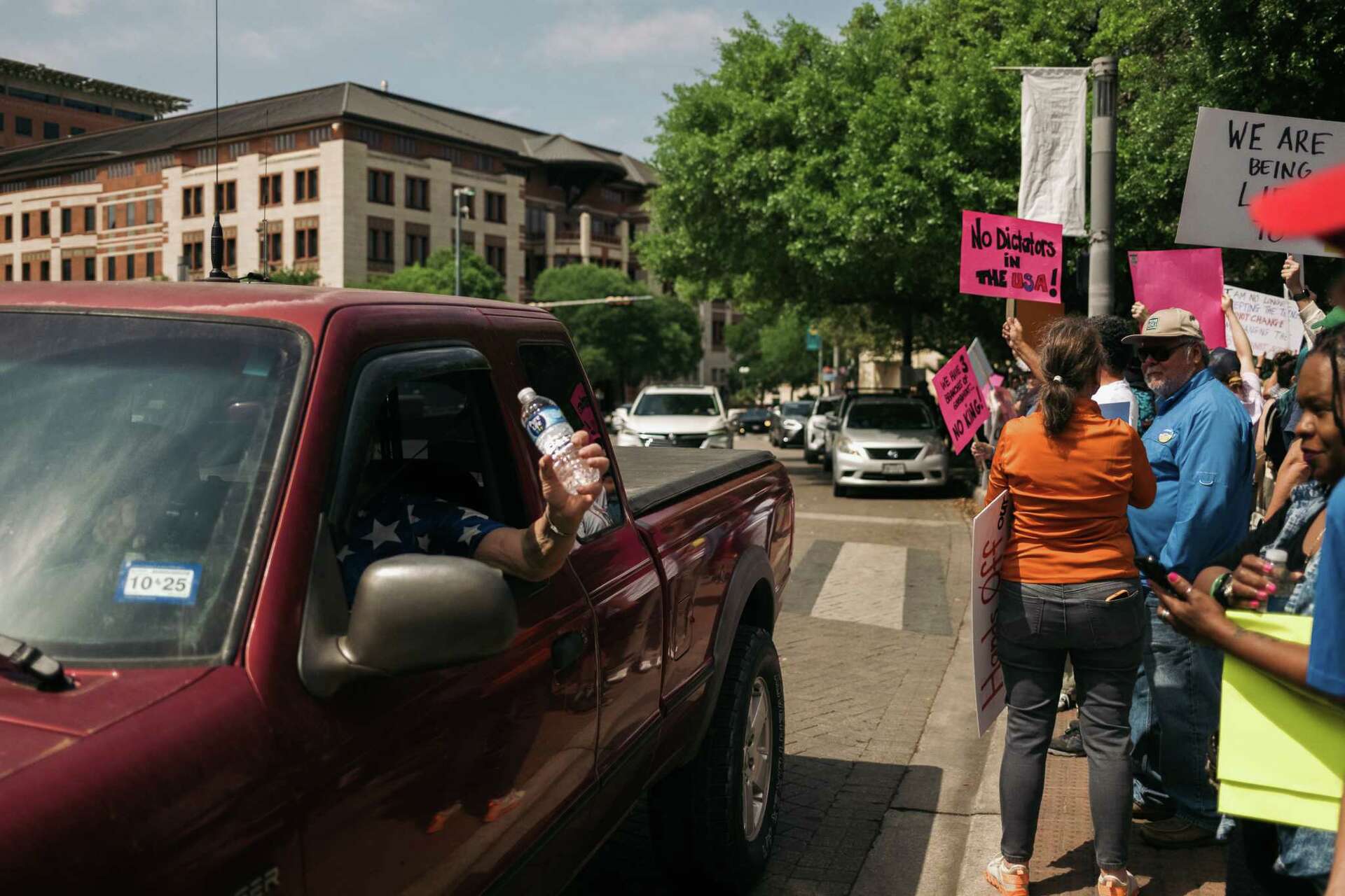 Hundreds march in San Antonio to tell Trump and Musk 'hands off'