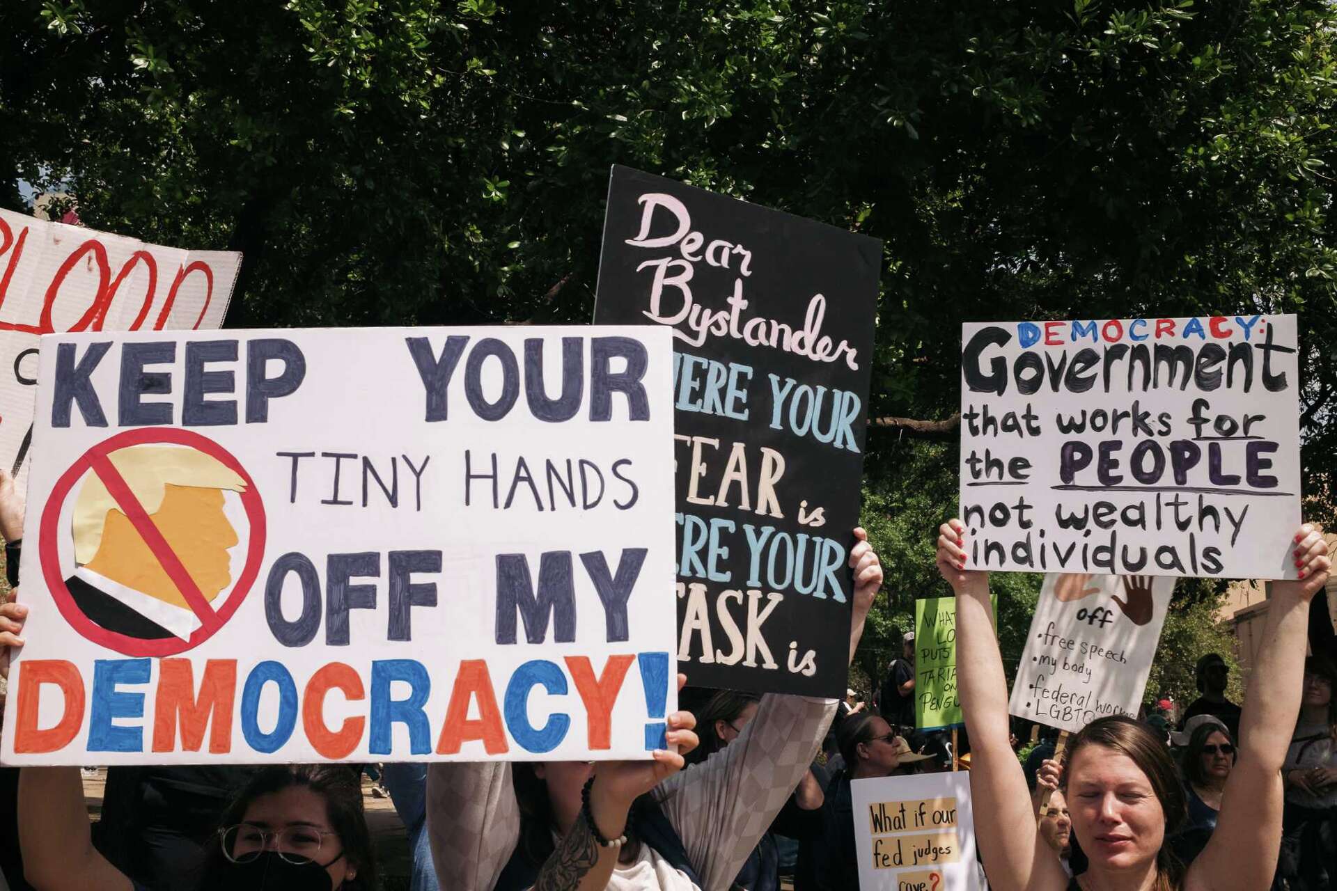 Hundreds march in San Antonio to tell Trump and Musk 'hands off'