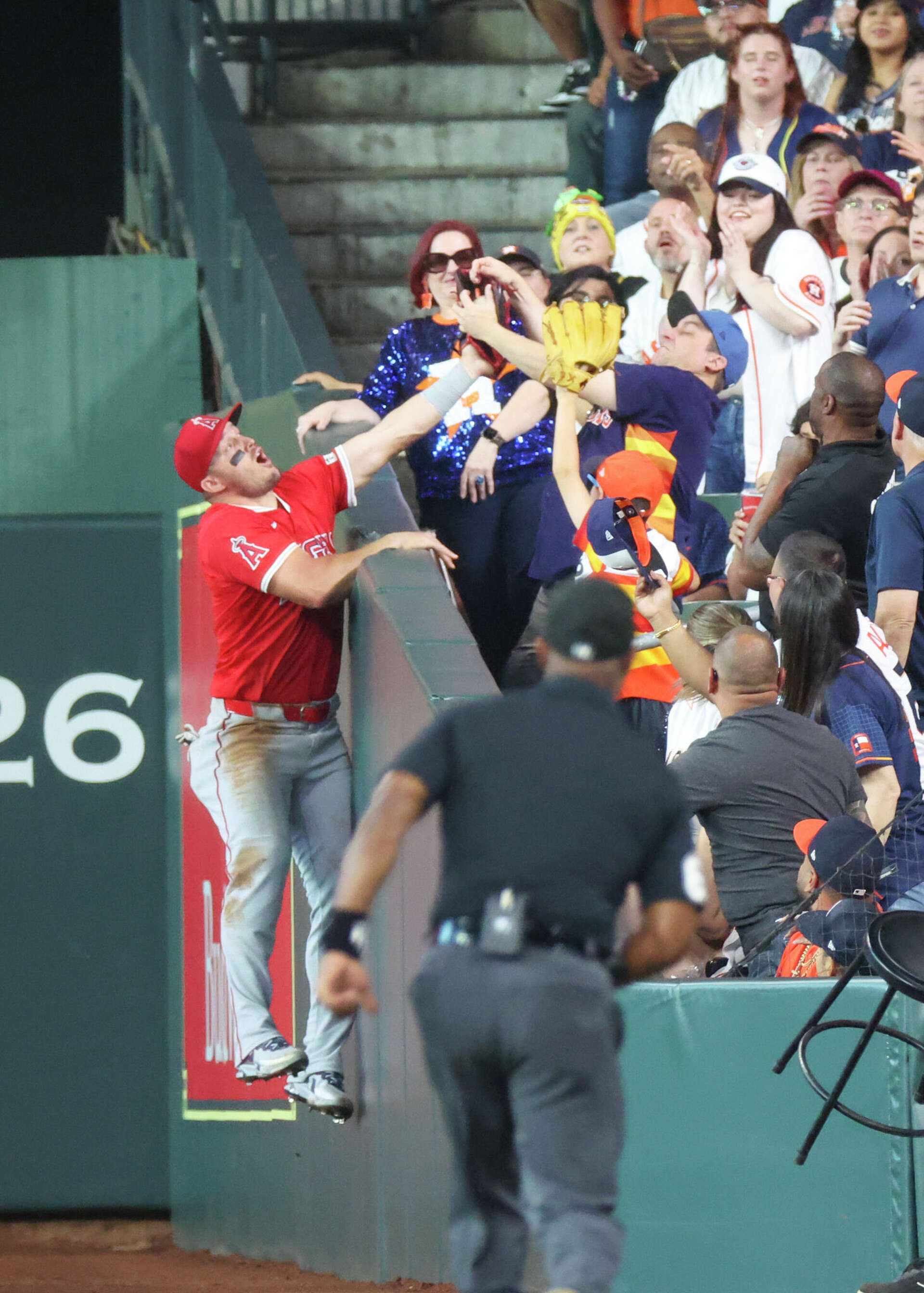 Astros fan rips ball out of Mike Trout's glove in game