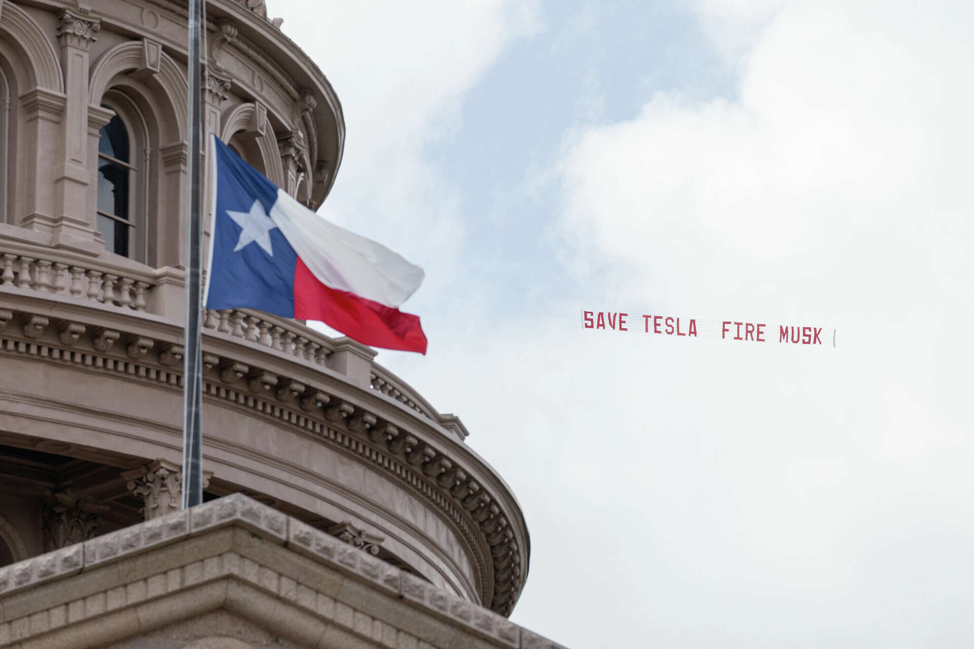 'Save Tesla Fire Musk' banner spotted flying over Texas Capitol