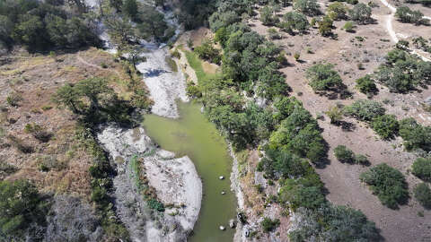 Canyon Lake is at a record low. Why is it still releasing water?