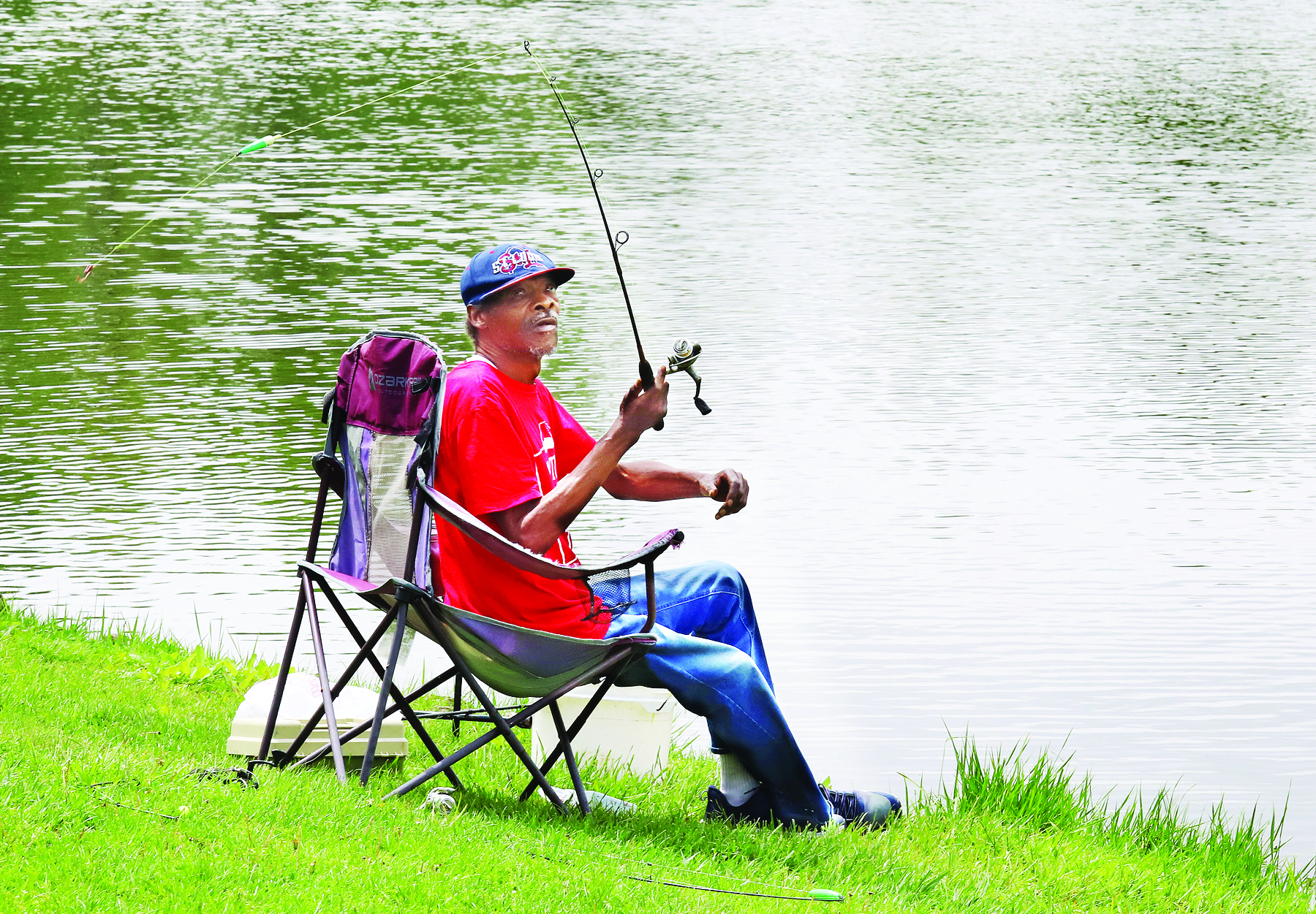 Alton man catches bluegill at Gordon Moore Park lake