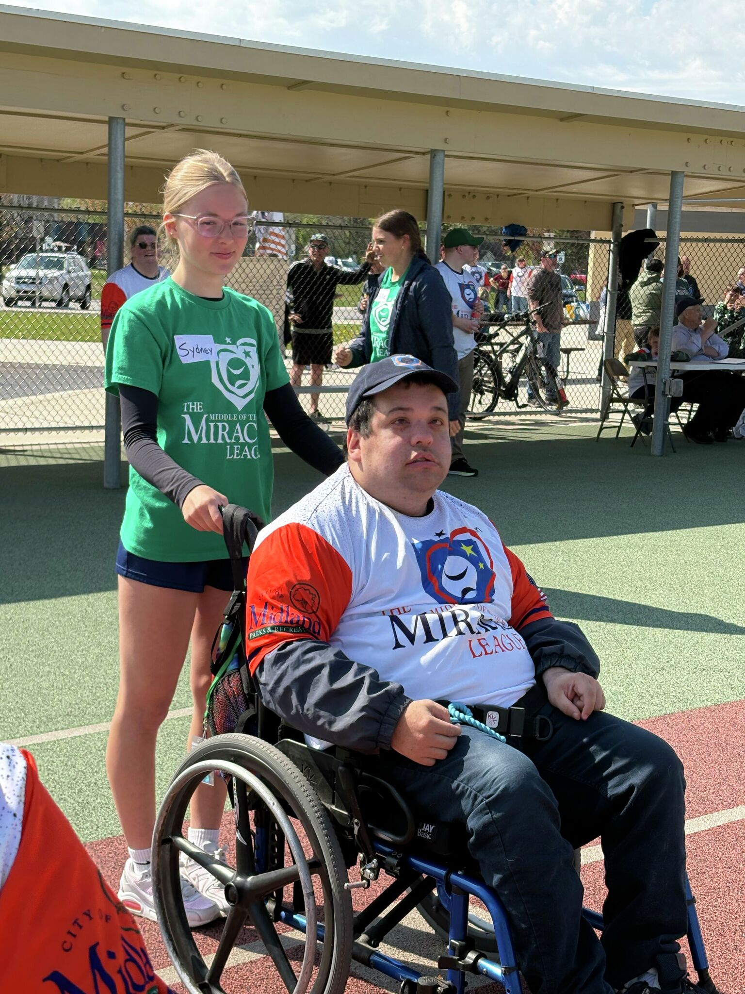 Midland High soccer players volunteer with Miracle League athletes