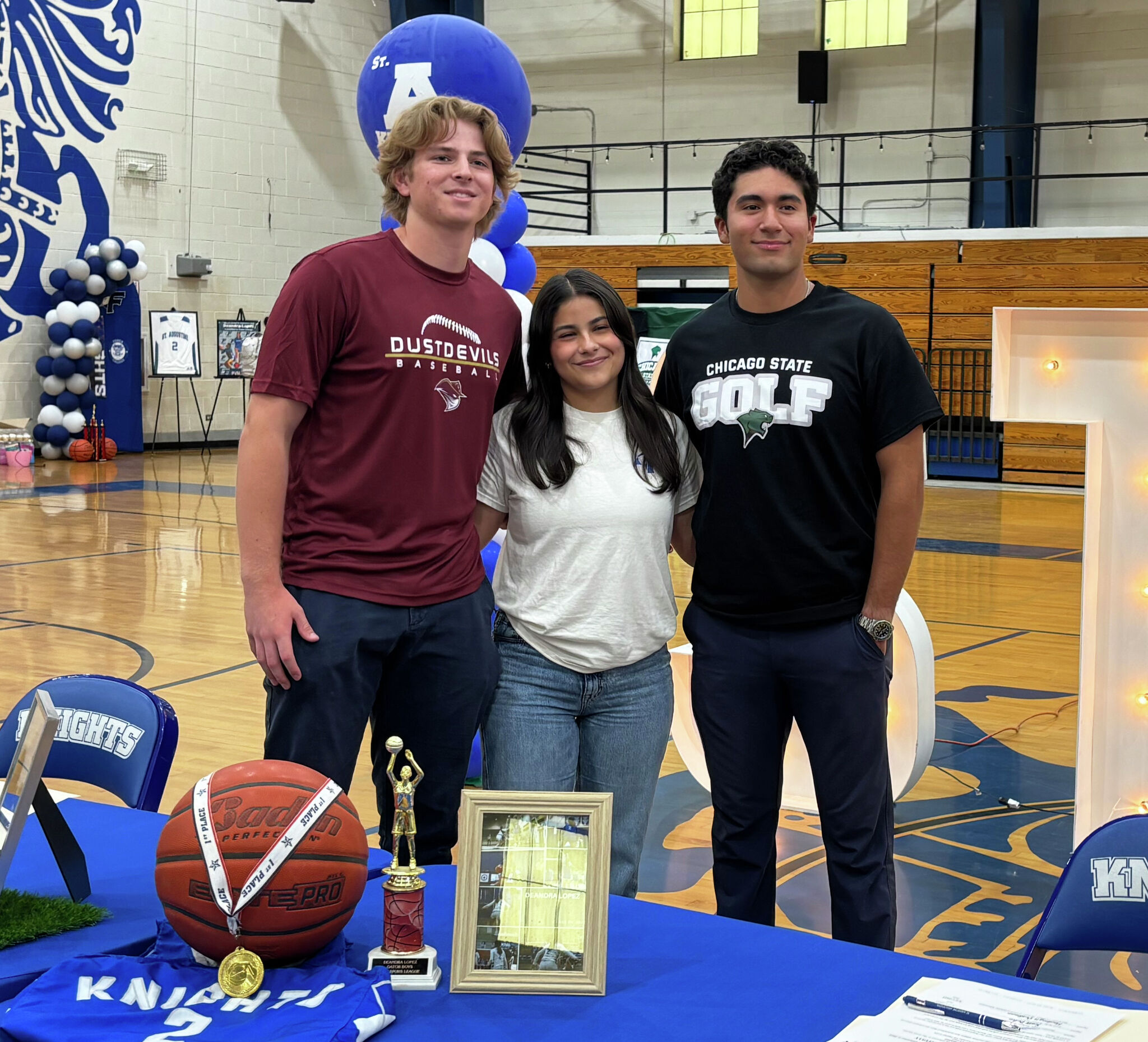 Three Laredo St. Augustine student-athletes make college commitments