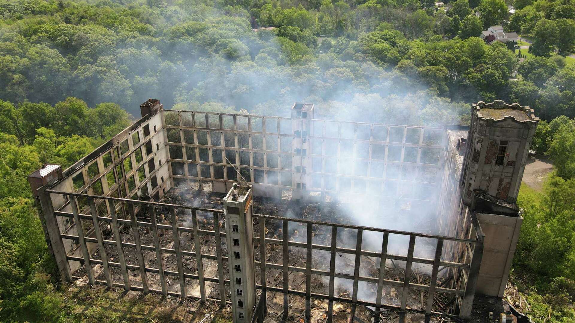 Photos: Smoking shell left after Victory Mills fire