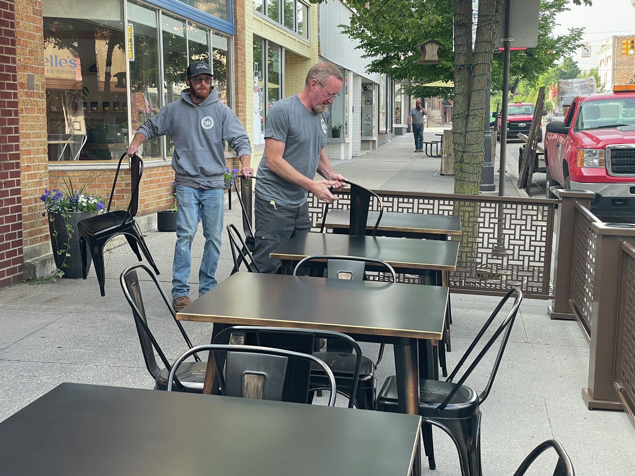 City employees set up outdoor seating in Big Rapids Michigan