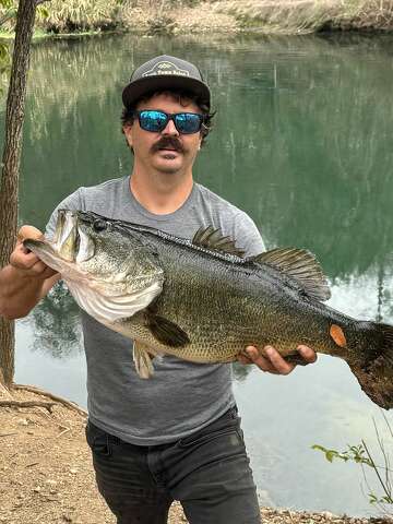Normal-size man sets record for largest-size bass hooked at Texas Lake