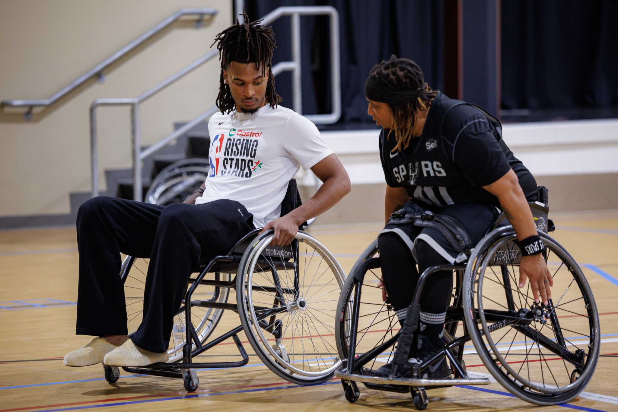 Spurs' Steph Castle, Julian Champagnie visit their parasport counters