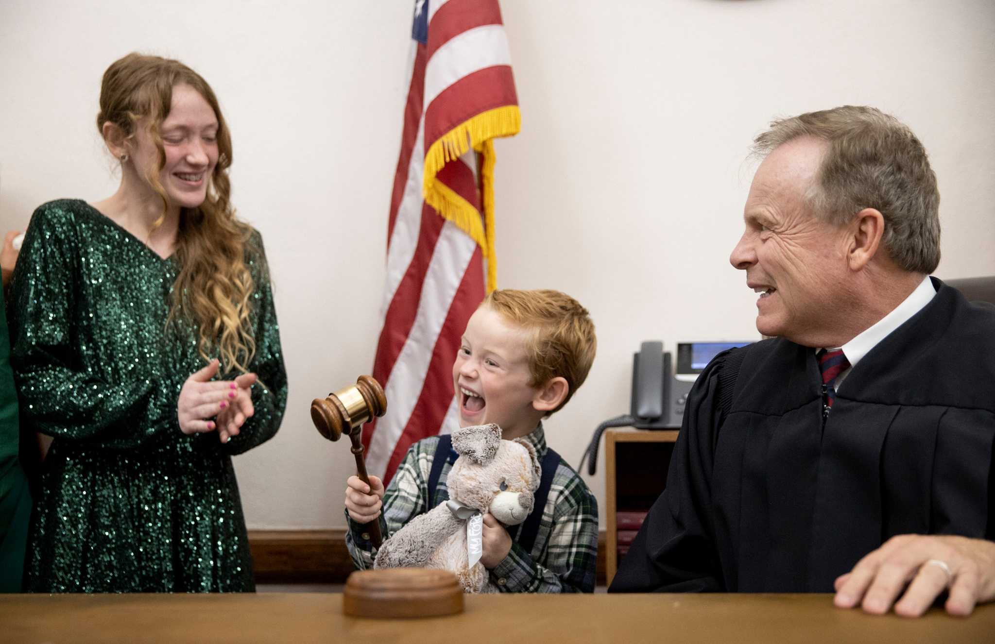 A dozen children join new families during Bastrop County Adoption Day