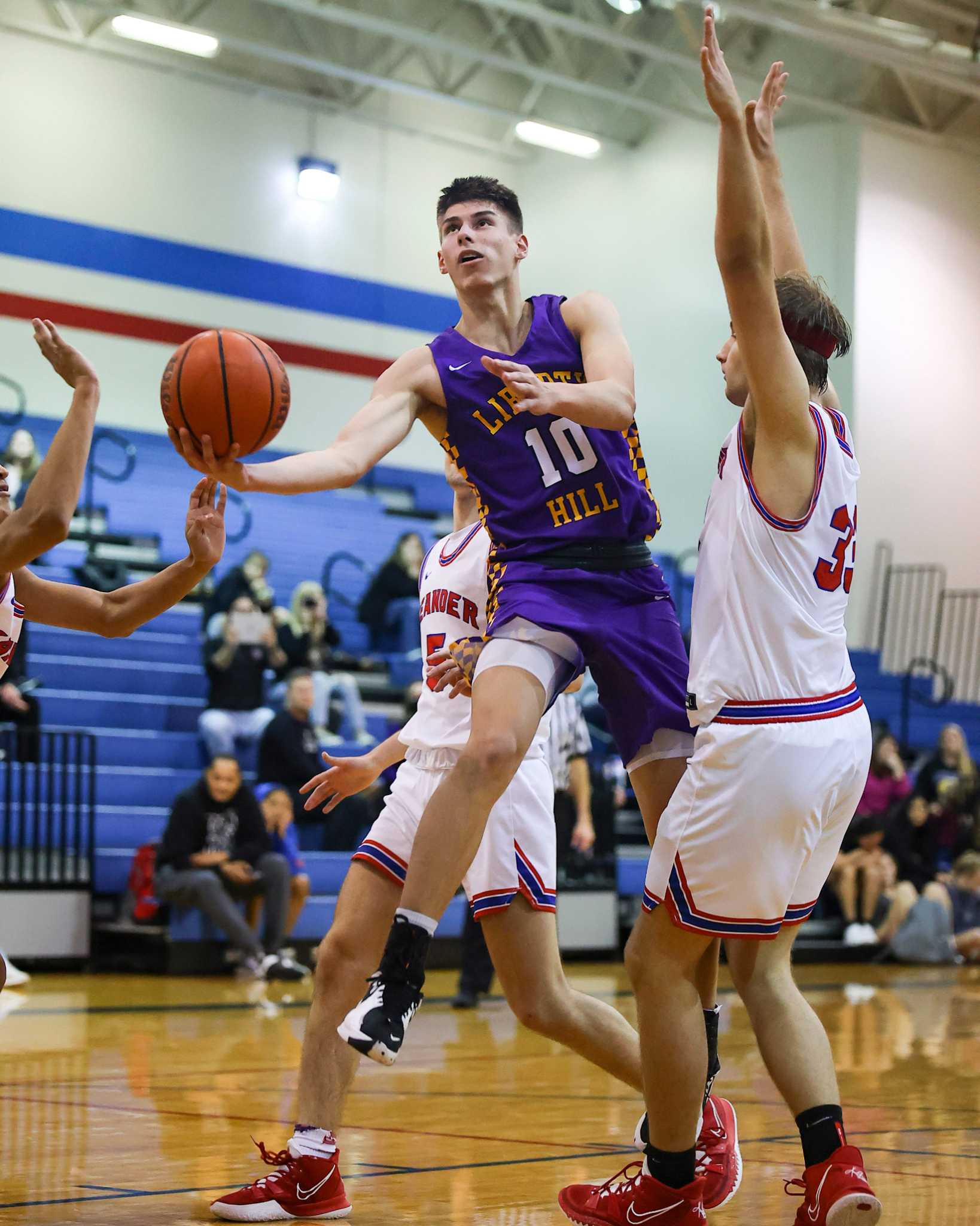 High school basketball: Liberty Hill boys fend off Leander, stay tied ...