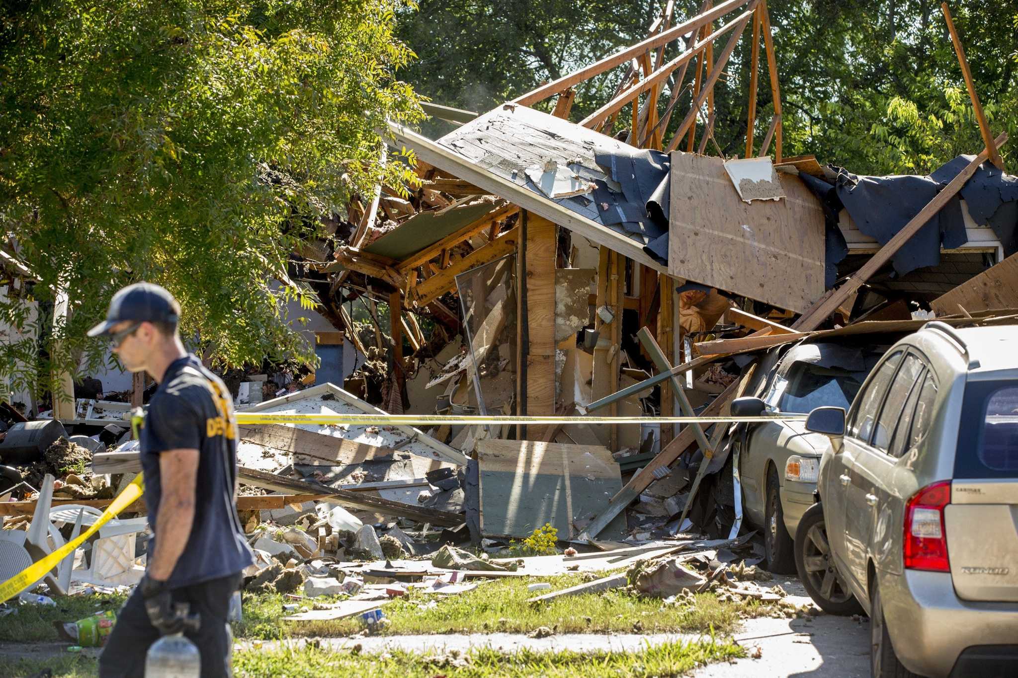 Woman in home explosion dies
