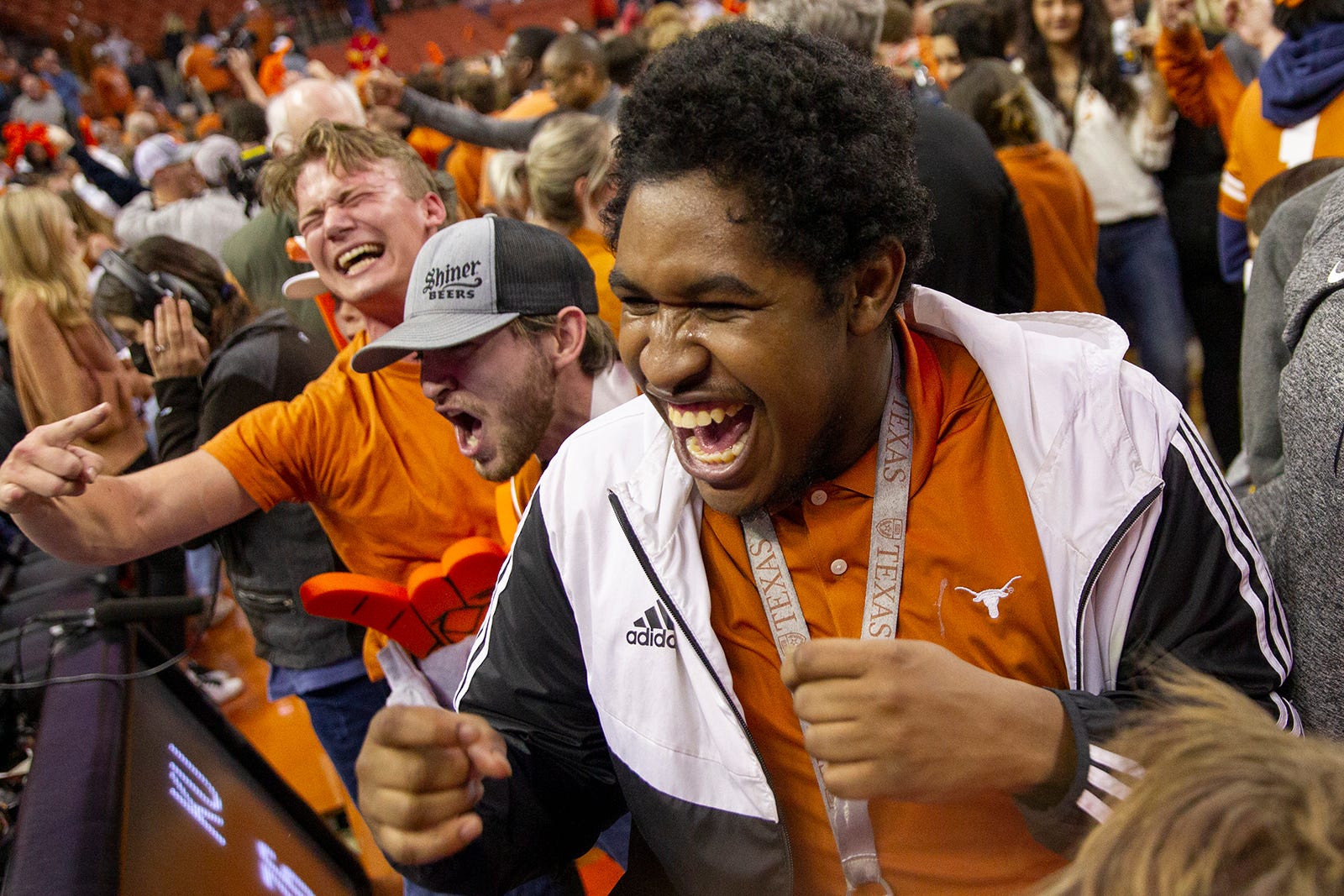 Watch Texas basketball fans rush the court, sing 'The Eyes of Texas ...