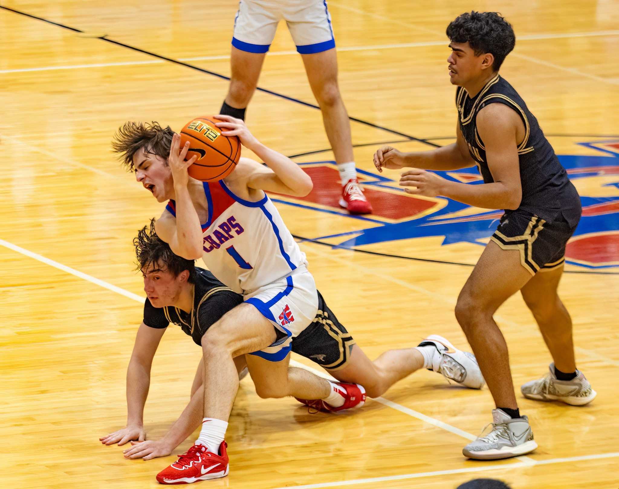 The Westlake boys beat Johnson 58-55 in District 26-6A game
