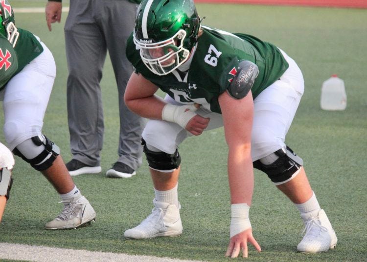 Strake Jesuit offensive tackle Max Merril signs with the Longhorns