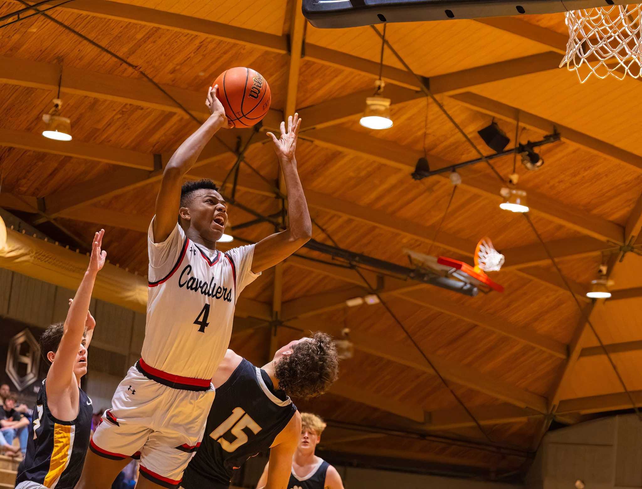 Lake Travis boys basketball team beat Dripping Springs 64-50 in 26-6A
