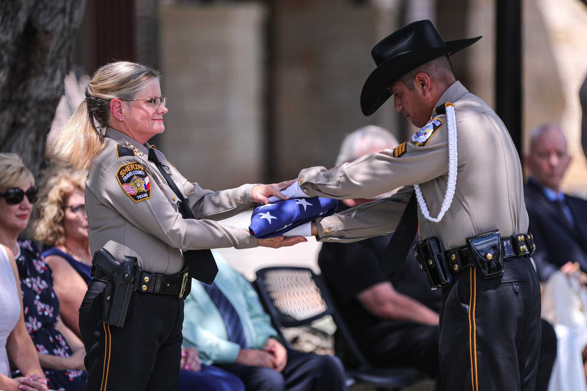 Denied for 15 months by COVID, community bids goodbye to Travis deputy