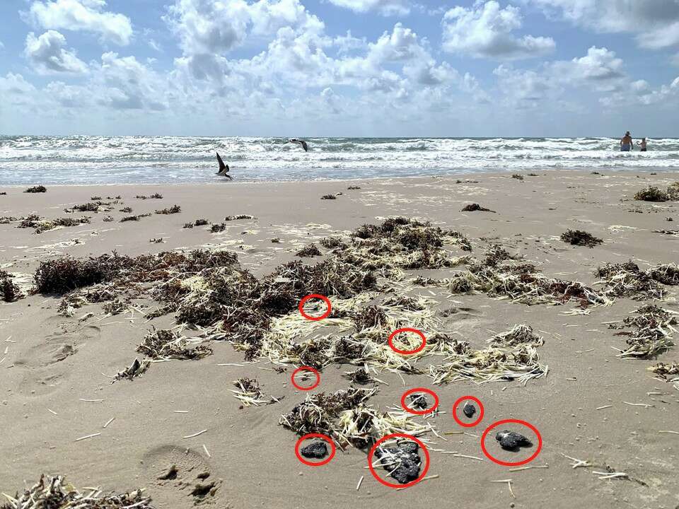 What to know about sticky tar balls invading Texas Gulf Coast beaches
