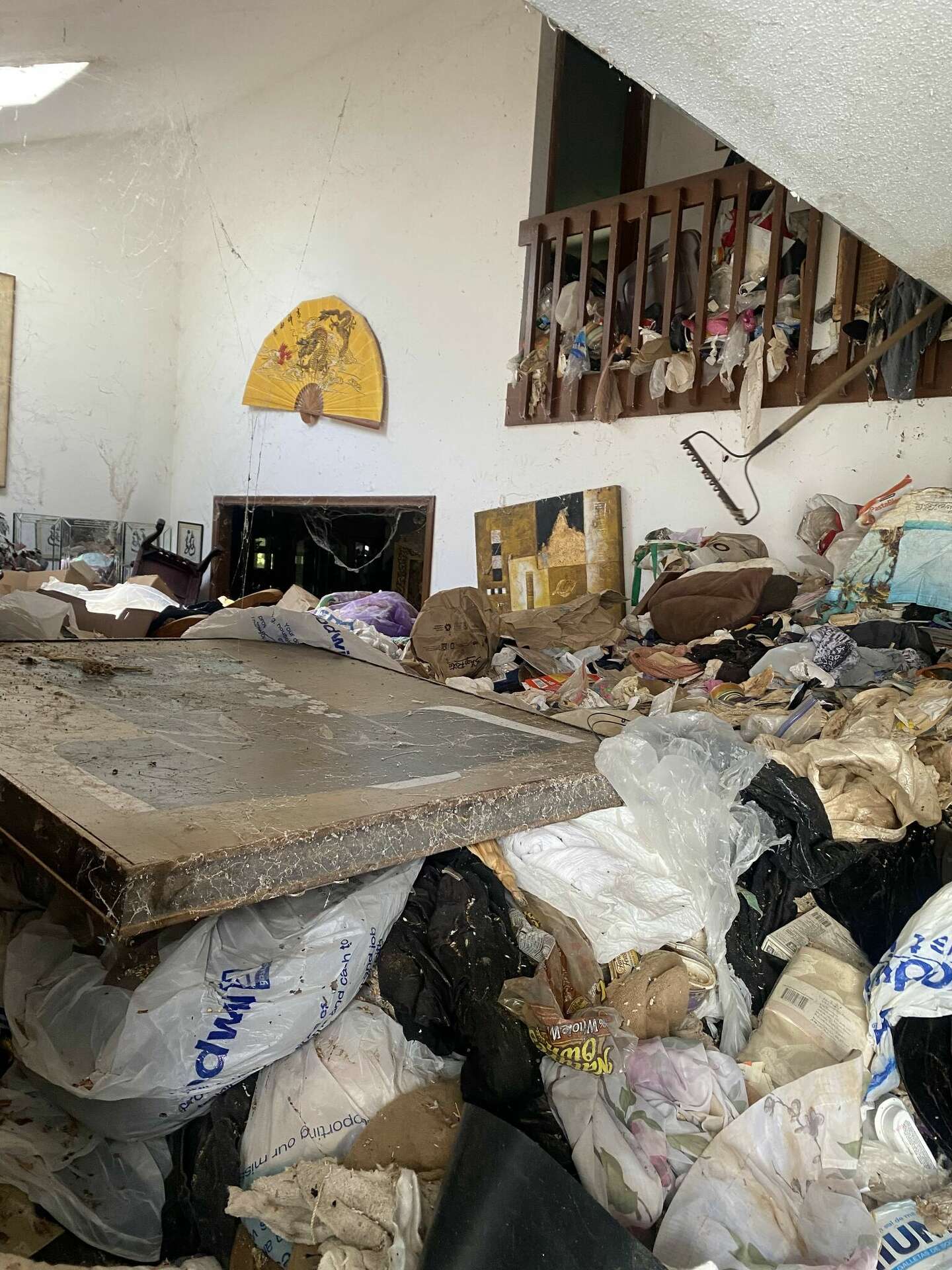 CT house where body found had debris piled high, photos, videos show