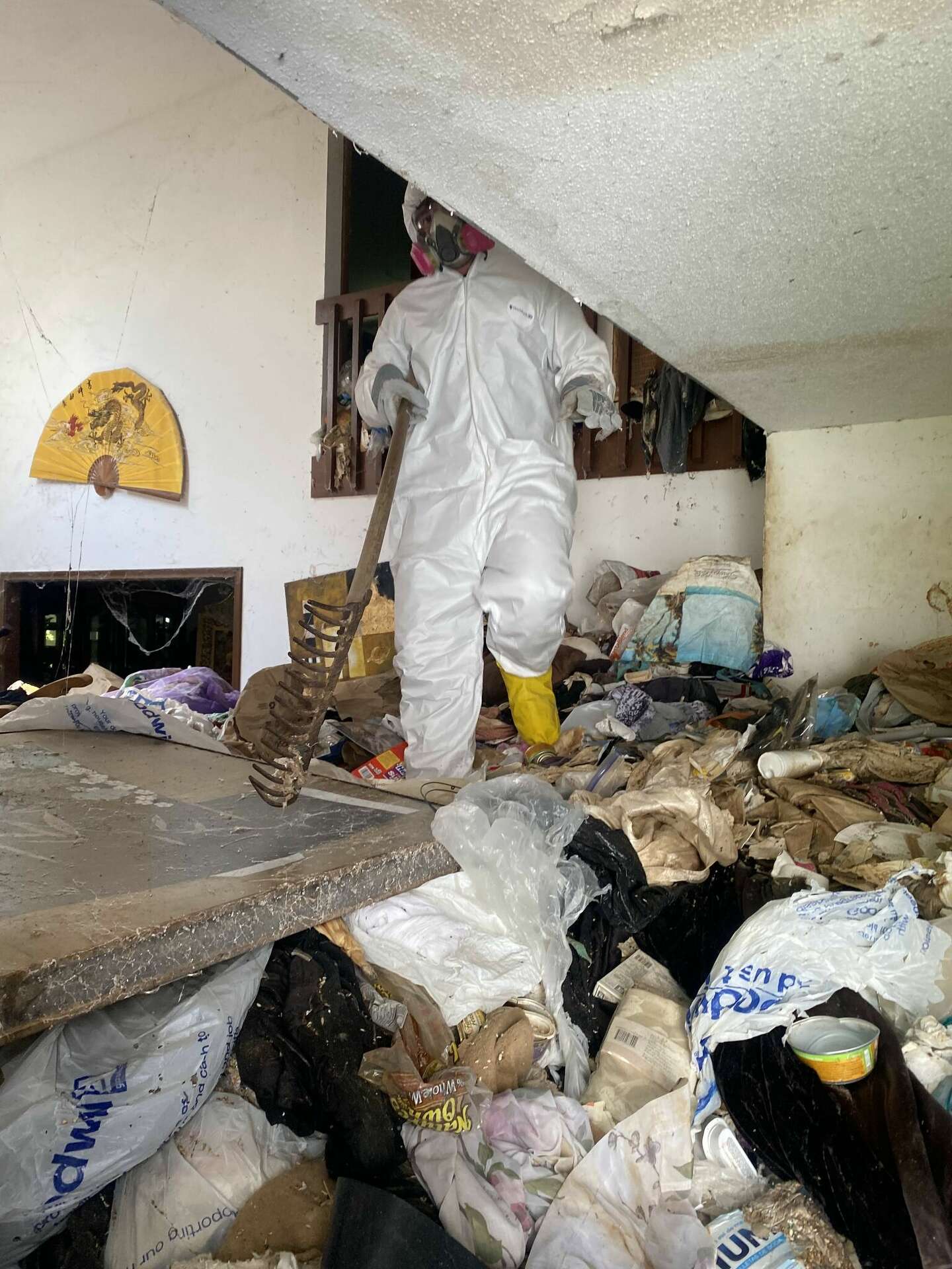 CT house where body found had debris piled high, photos, videos show
