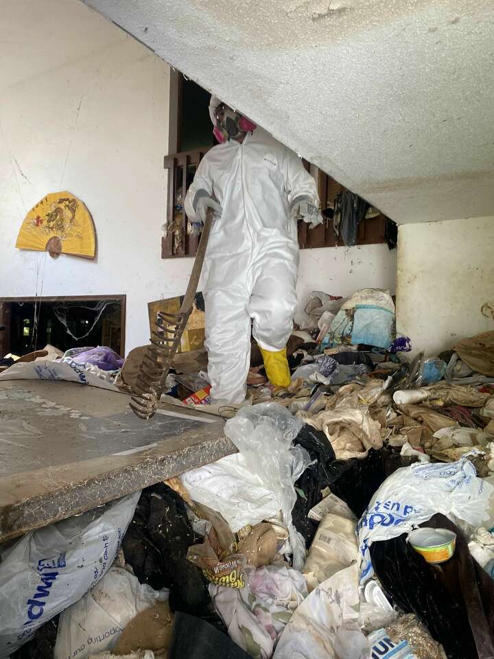 CT house where body found had debris piled high, photos, videos show