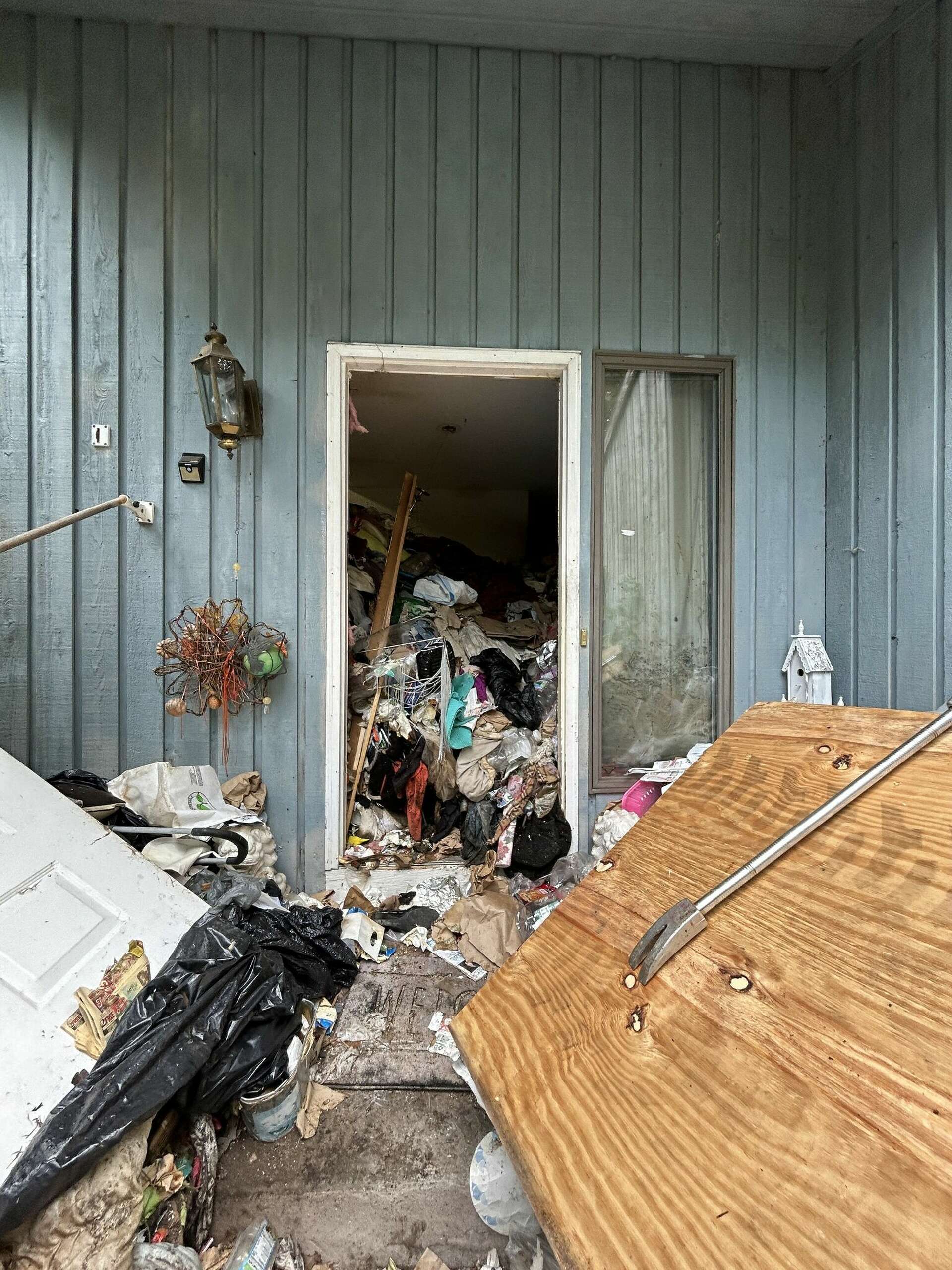 CT house where body found had debris piled high, photos, videos show