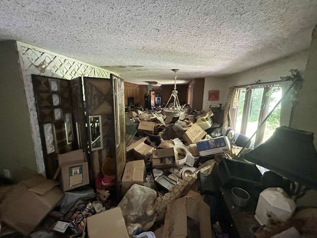 CT house where body found had debris piled high, photos, videos show