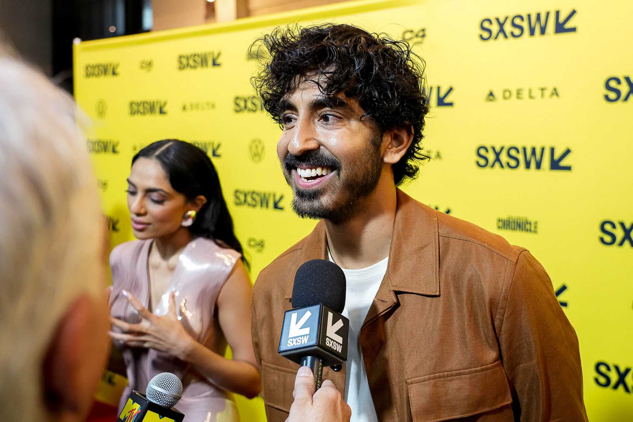 At SXSW, Dev Patel explains how a broken hand couldn't stop him from ...