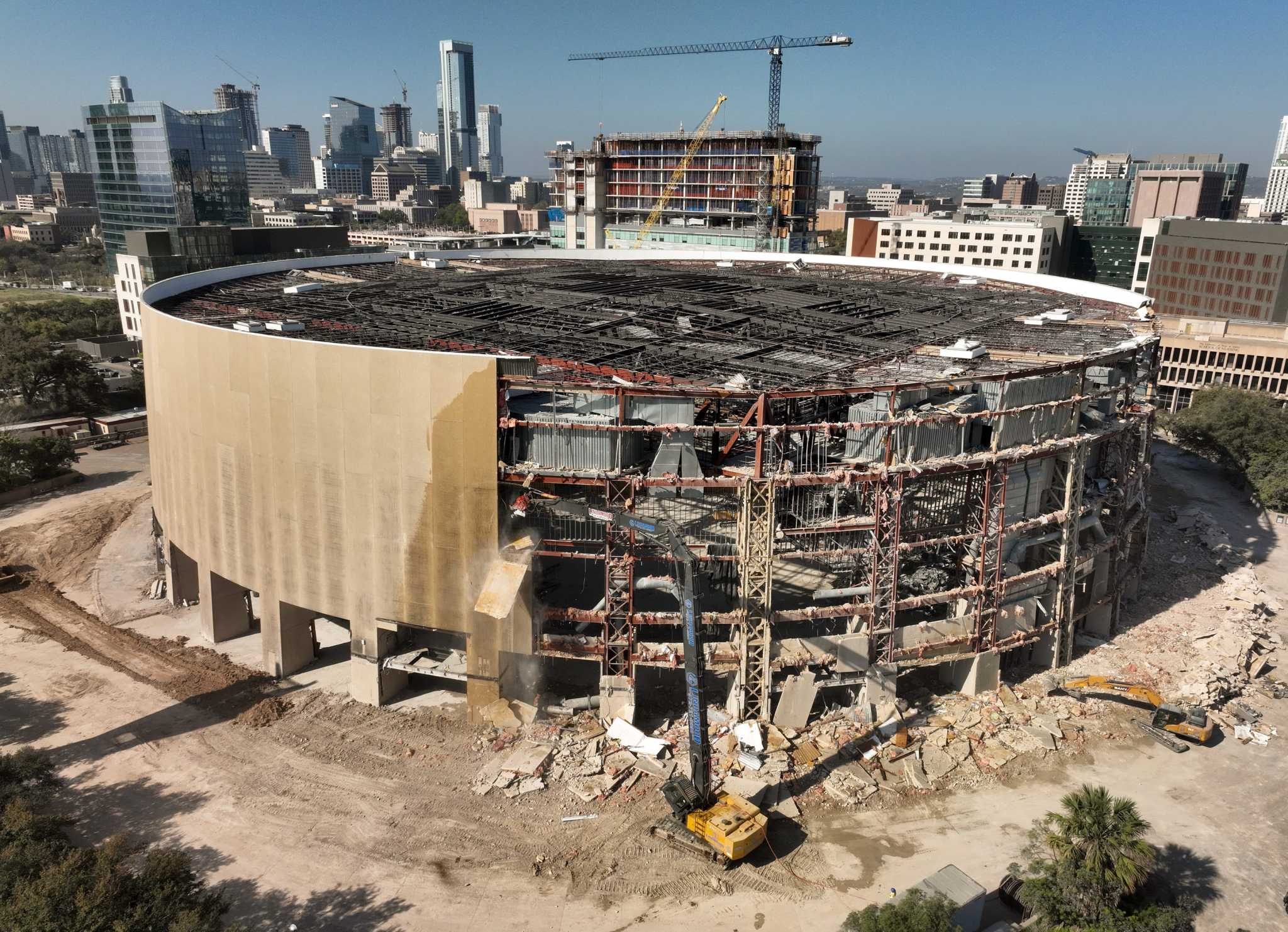 Photos show Frank Erwin Center's exterior walls being demolished
