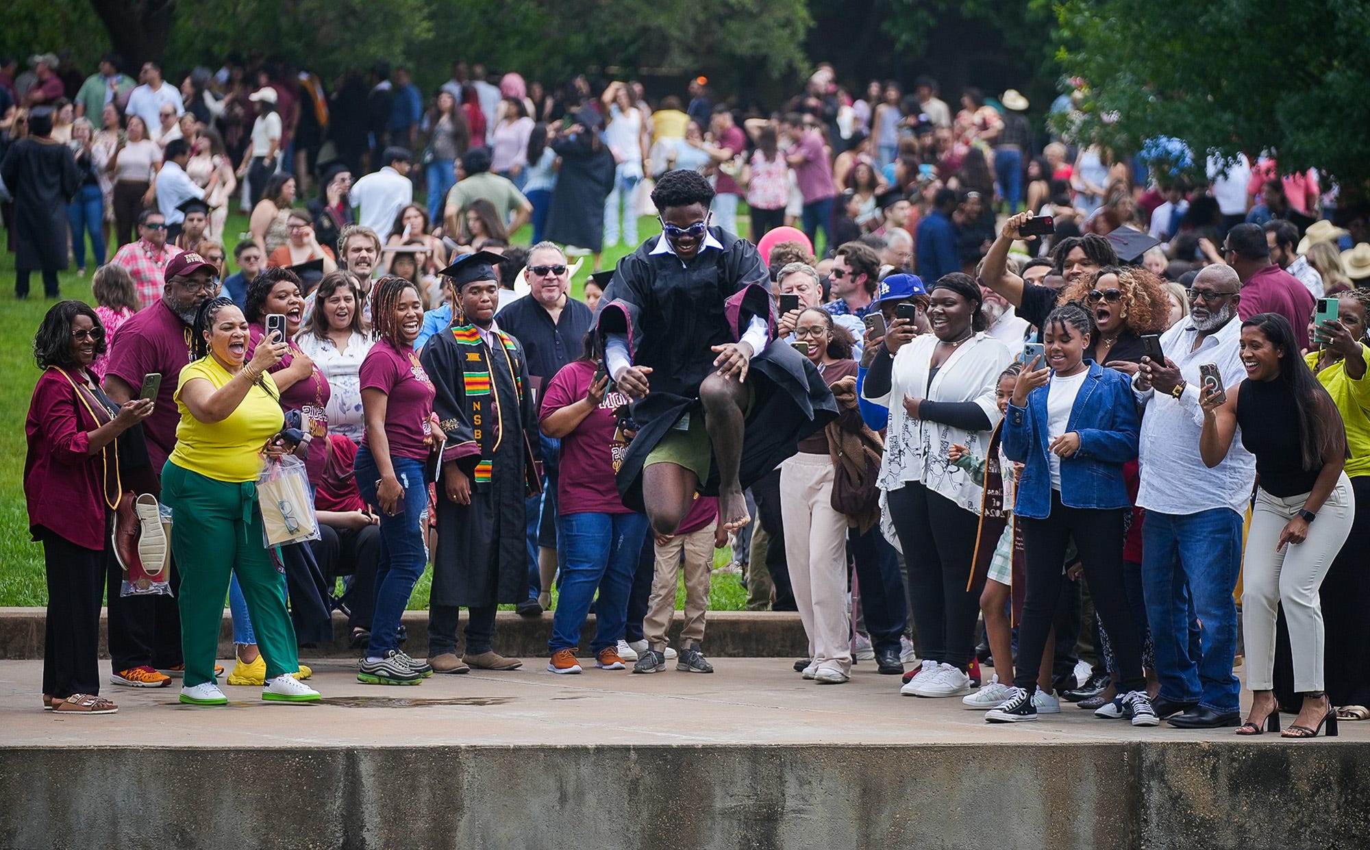 Texas State celebrates 2024 Graduation with San Marcos River jump