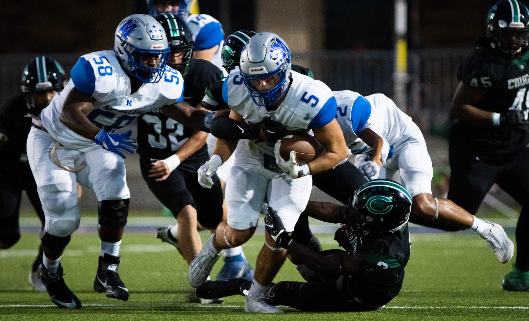 McCallum football secures eighth straight playoff berth with 35-24 win