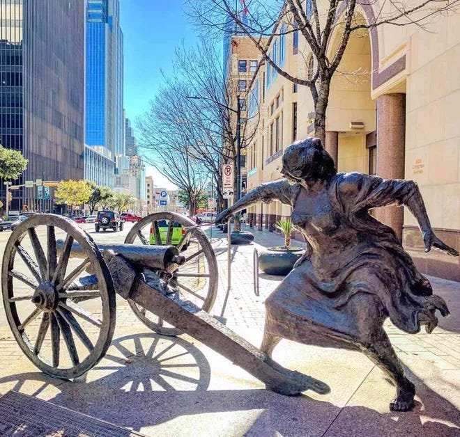 Angelina Eberly, hero of early Austin, watches over Congress Avenue